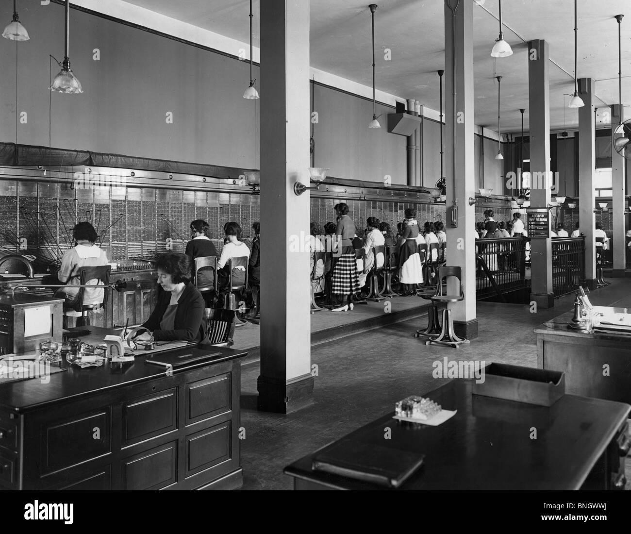 Telephone operators operating switchboards Stock Photo - Alamy
