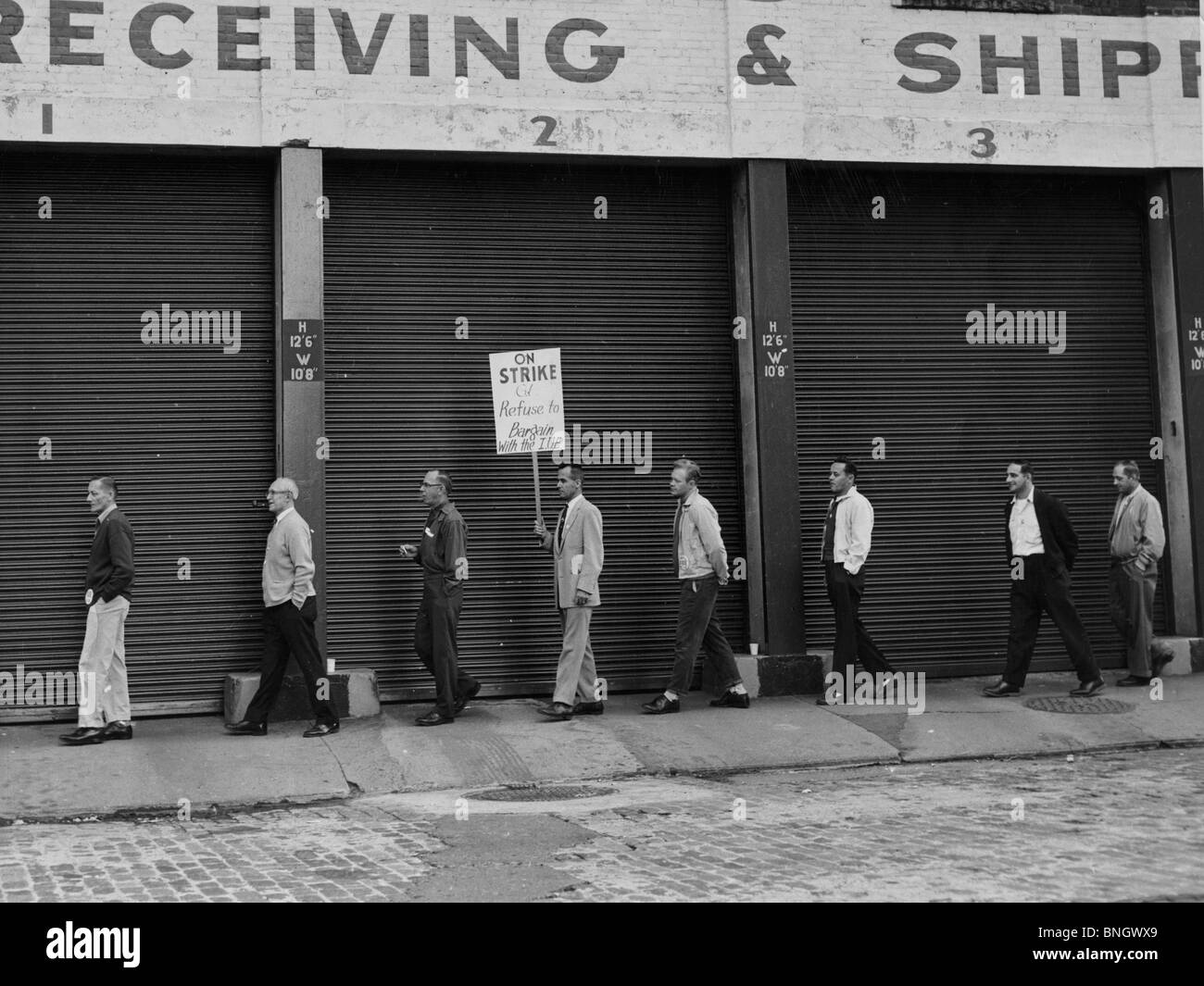 Standing building exterior holding placard text protestor social issues ...