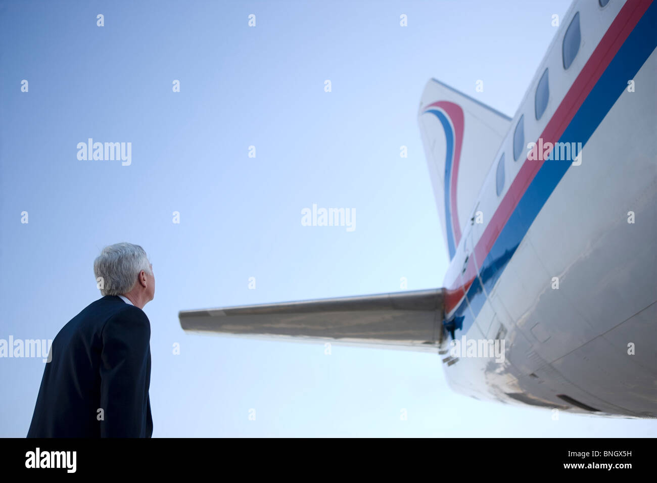Pilot looking at an plane Stock Photo - Alamy