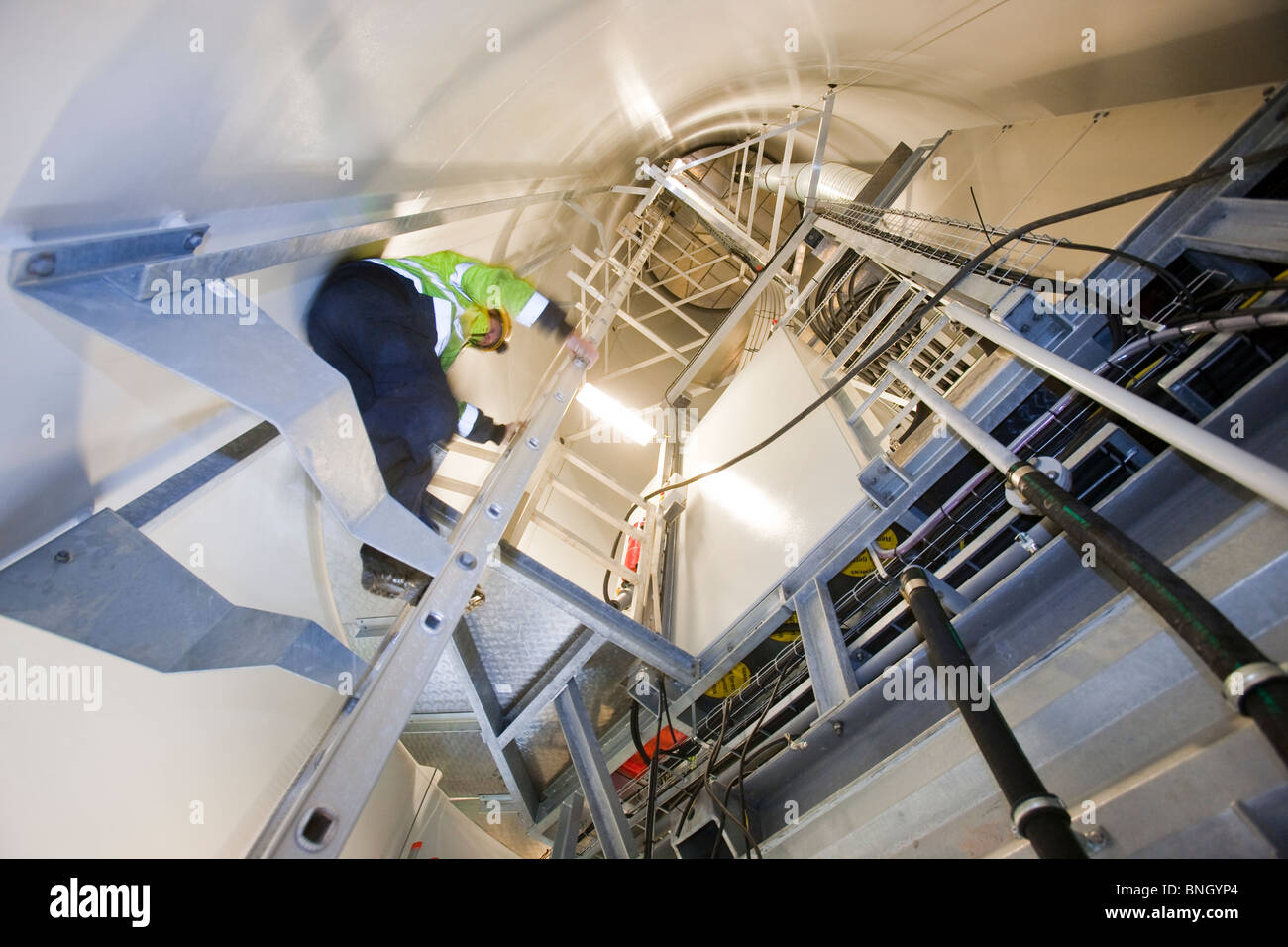 An engineer climbs the ladder of a Siemens wind turbine tower, destined for the Walney offshore ...