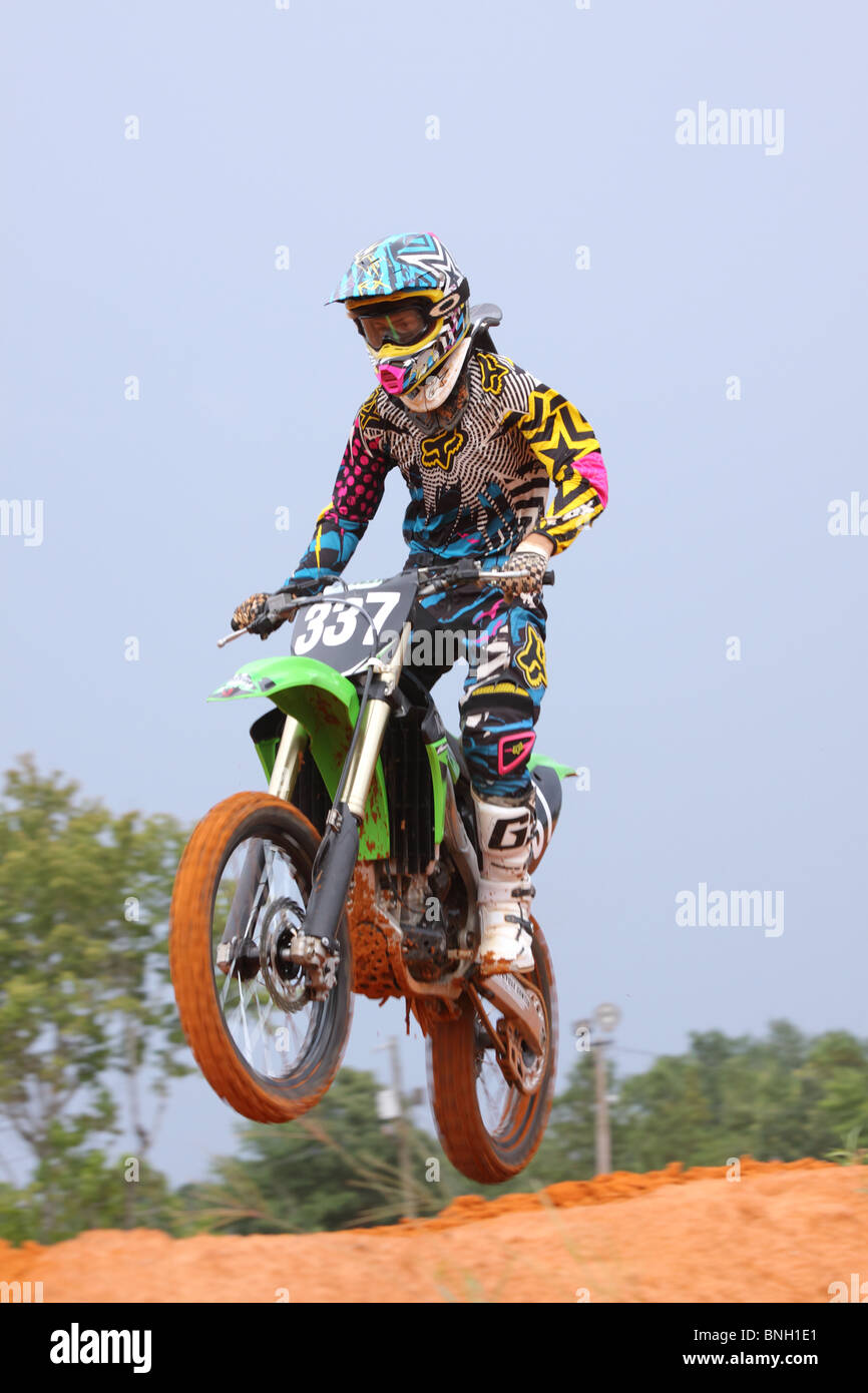 motorcycle rider on a dirt bike running a motocross track Stock Photo ...