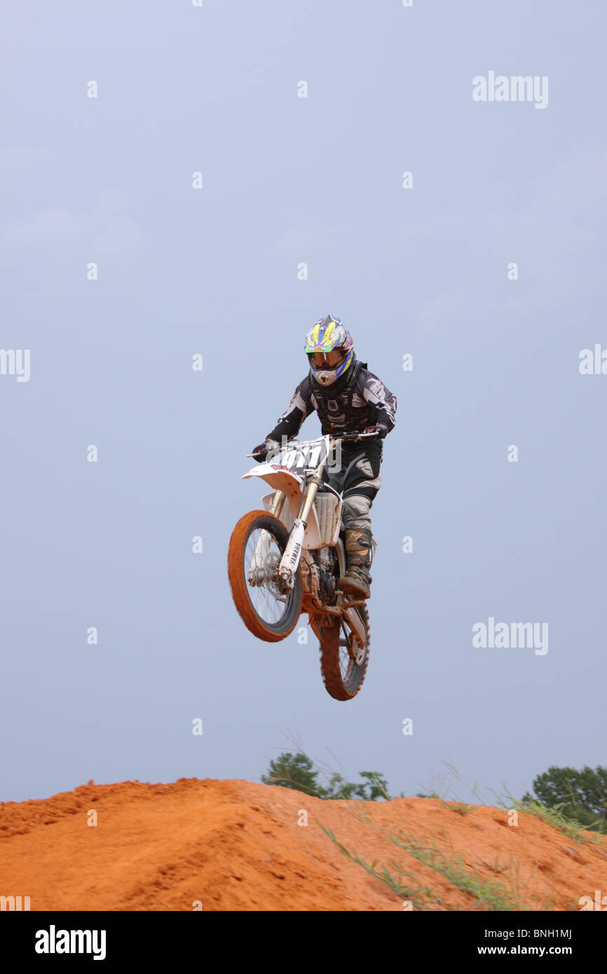 motorcycle rider on a dirt bike running a motocross track Stock Photo ...