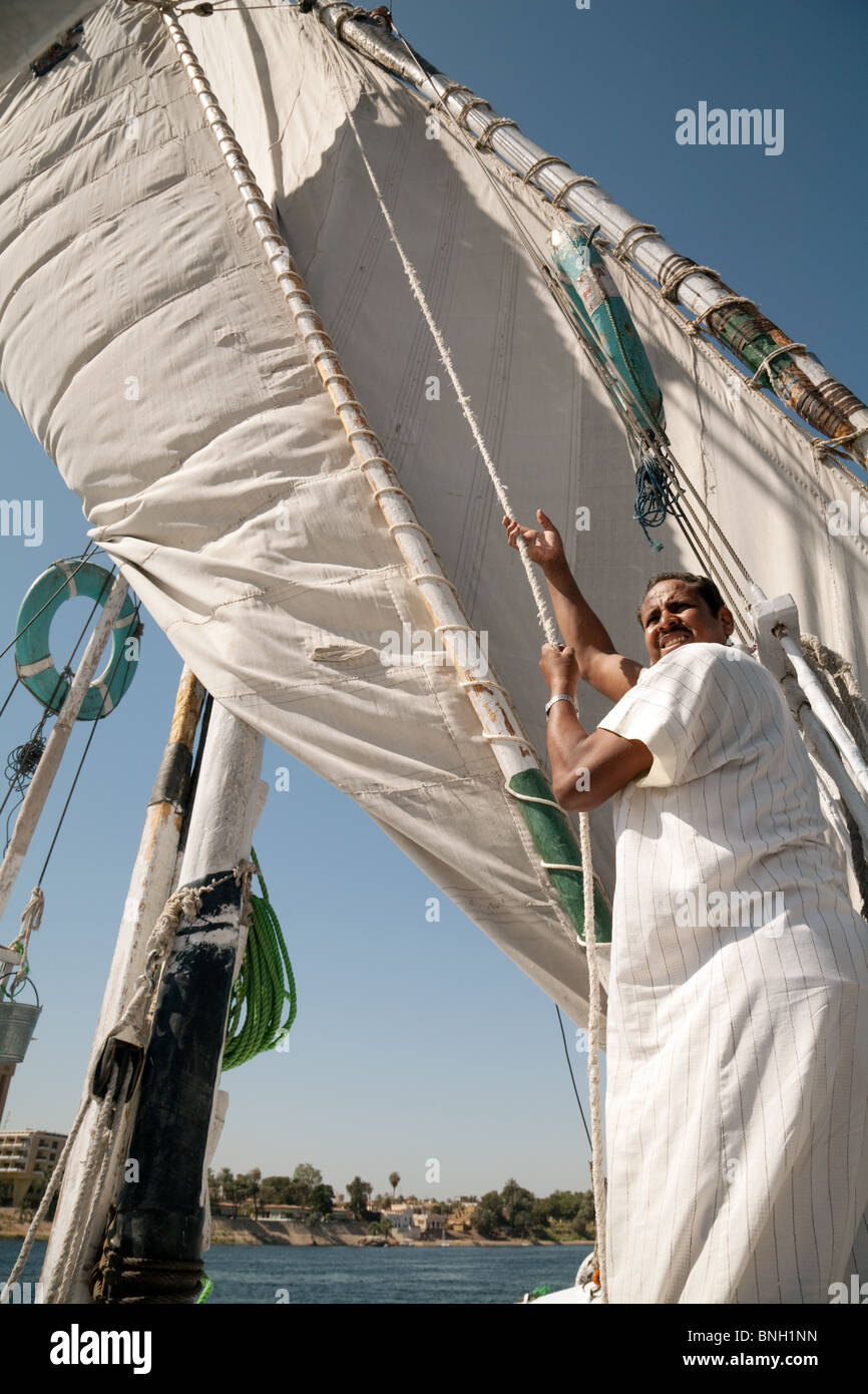 An egyptian sailor on his felucca, River Nile at Aswan, Upper Egypt ...