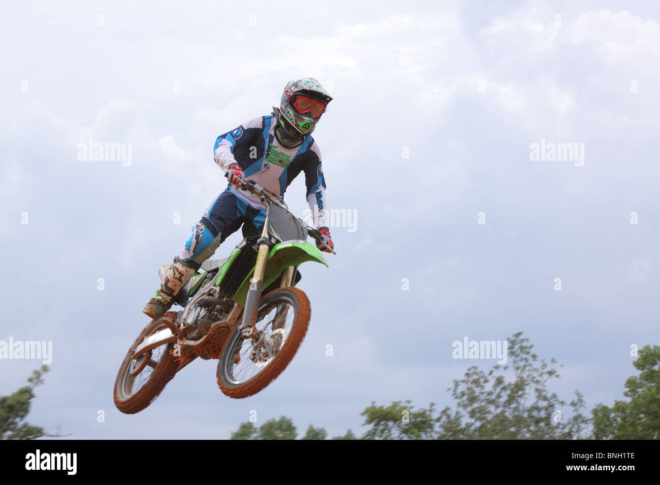 motorcycle rider on a dirt bike running a motocross track Stock Photo ...