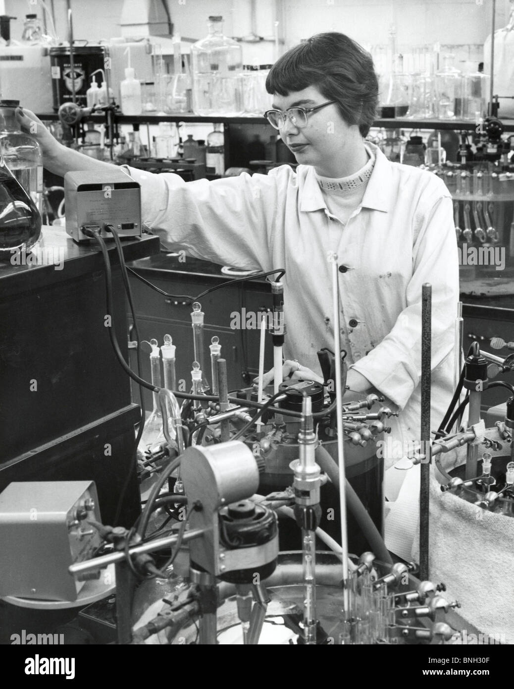 Female scientist working in a laboratory, American Viscose Corporation ...