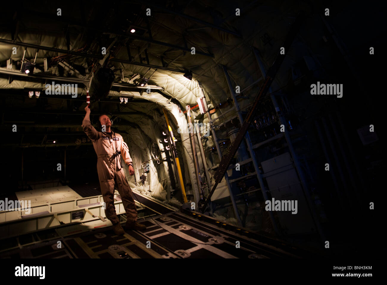 Loadmaster and raised ramp on a Lockheed Martin-built C-130J Hercules ...