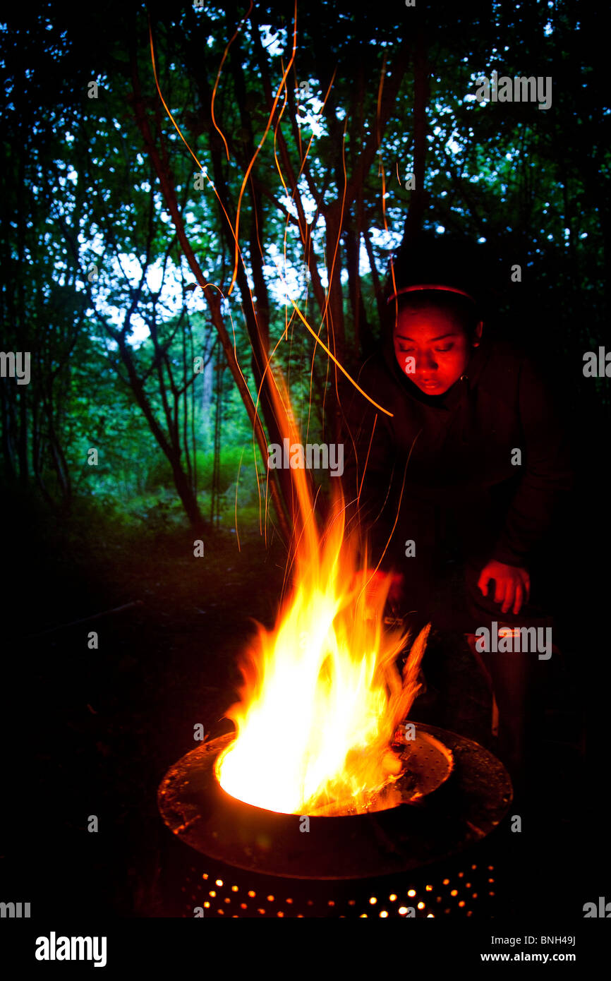 Woman cooking over open fire hi-res stock photography and images - Alamy