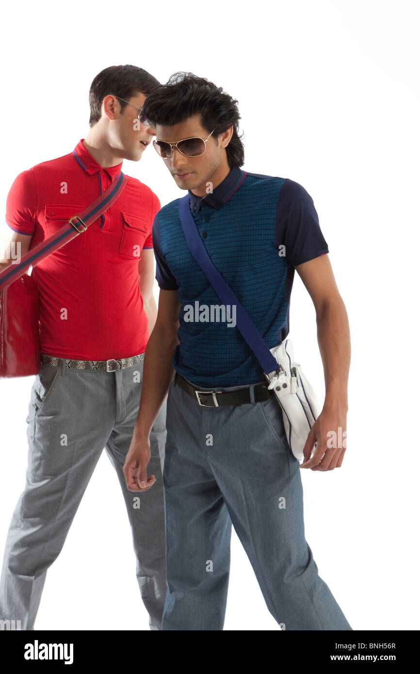 Two young men on white background Stock Photo - Alamy