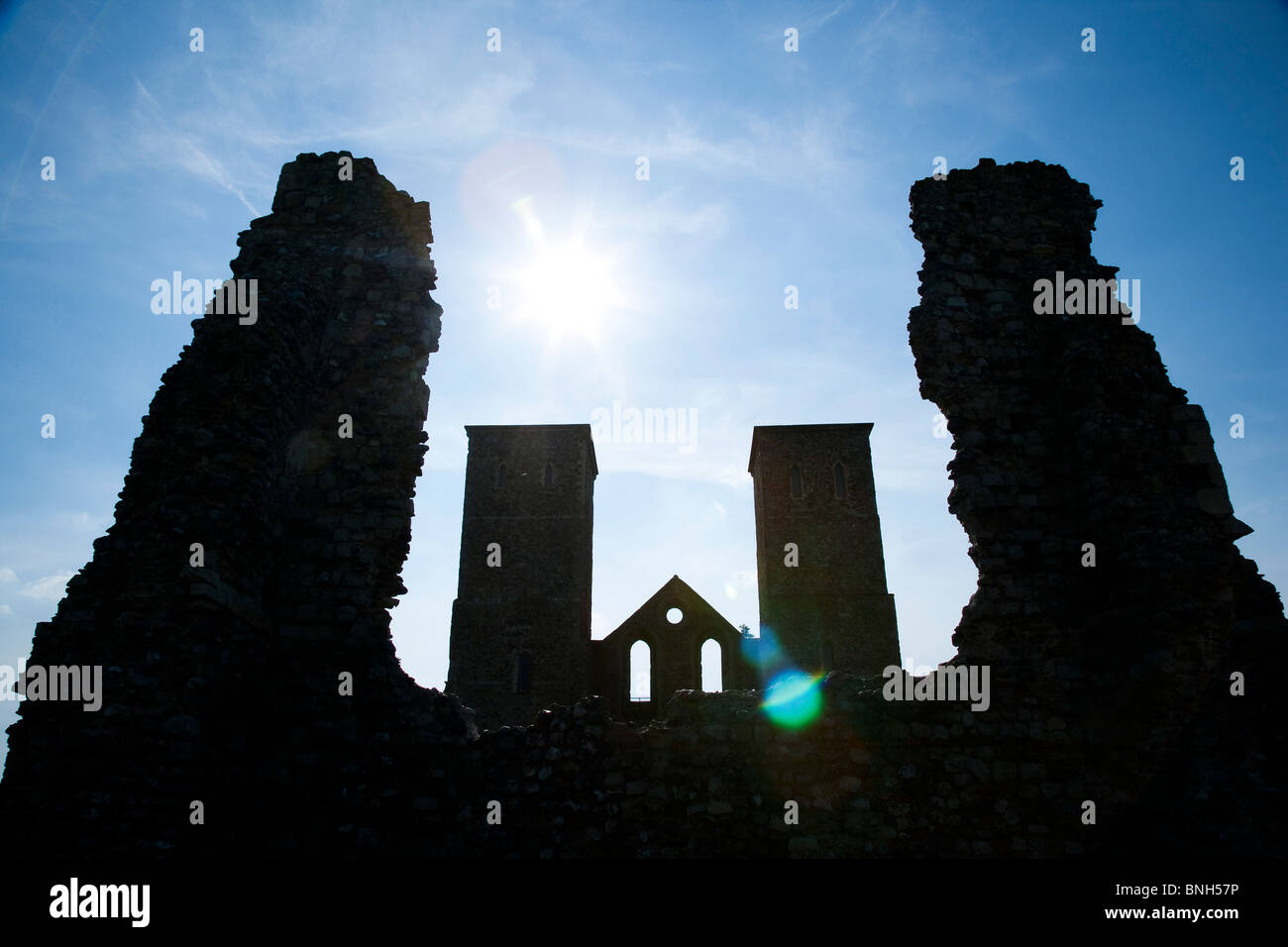 Silhouette of Reculver castle on the Kent coastline. Twin towers of ...
