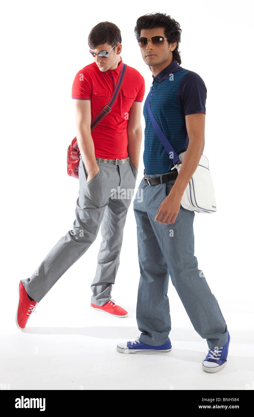 Two young men on white background Stock Photo - Alamy