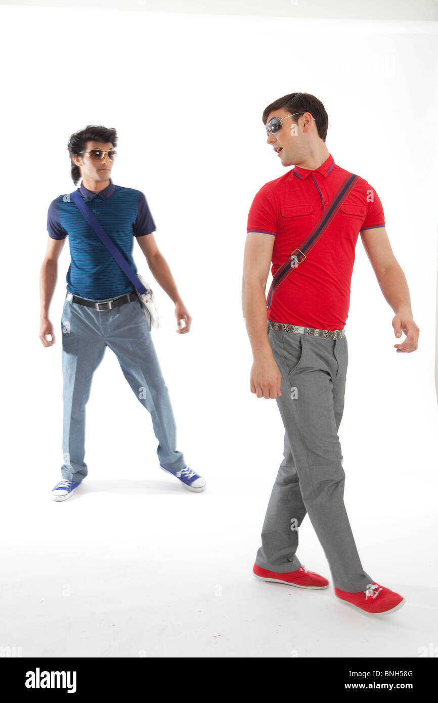 Two young men on white background Stock Photo - Alamy