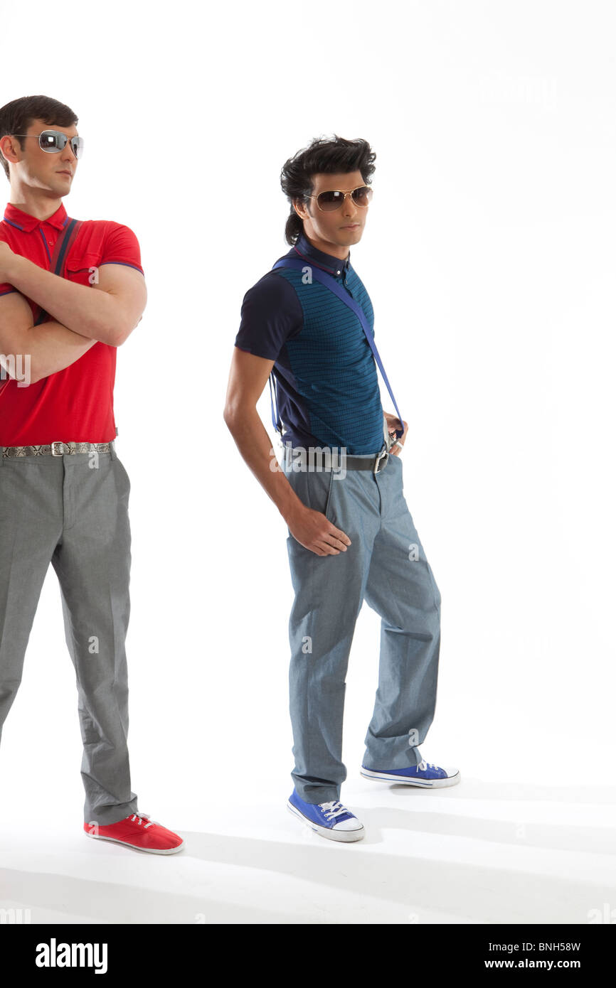 Two young men on white background Stock Photo - Alamy