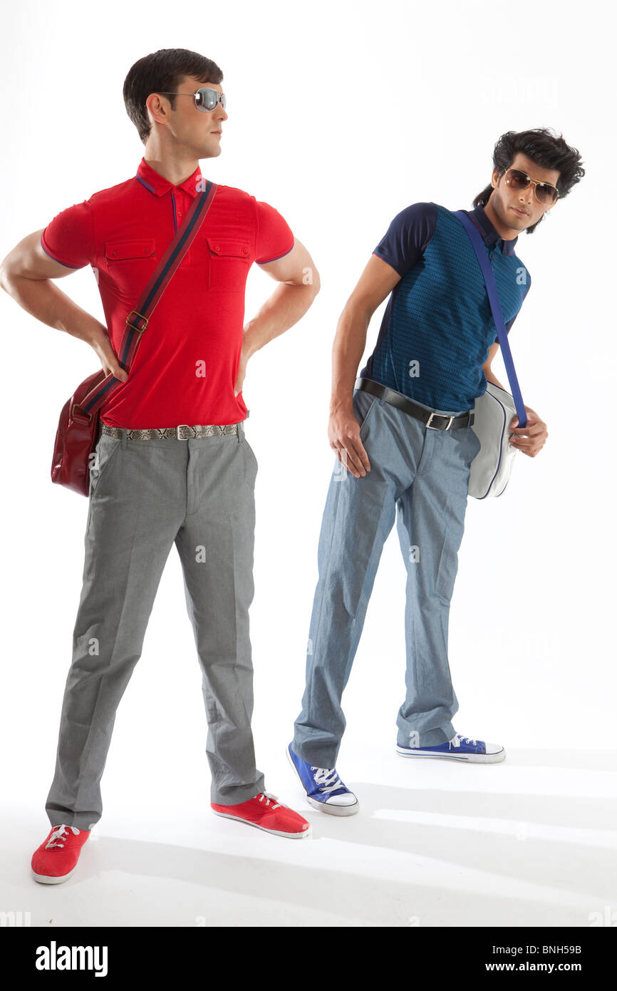Two young men on white background Stock Photo - Alamy