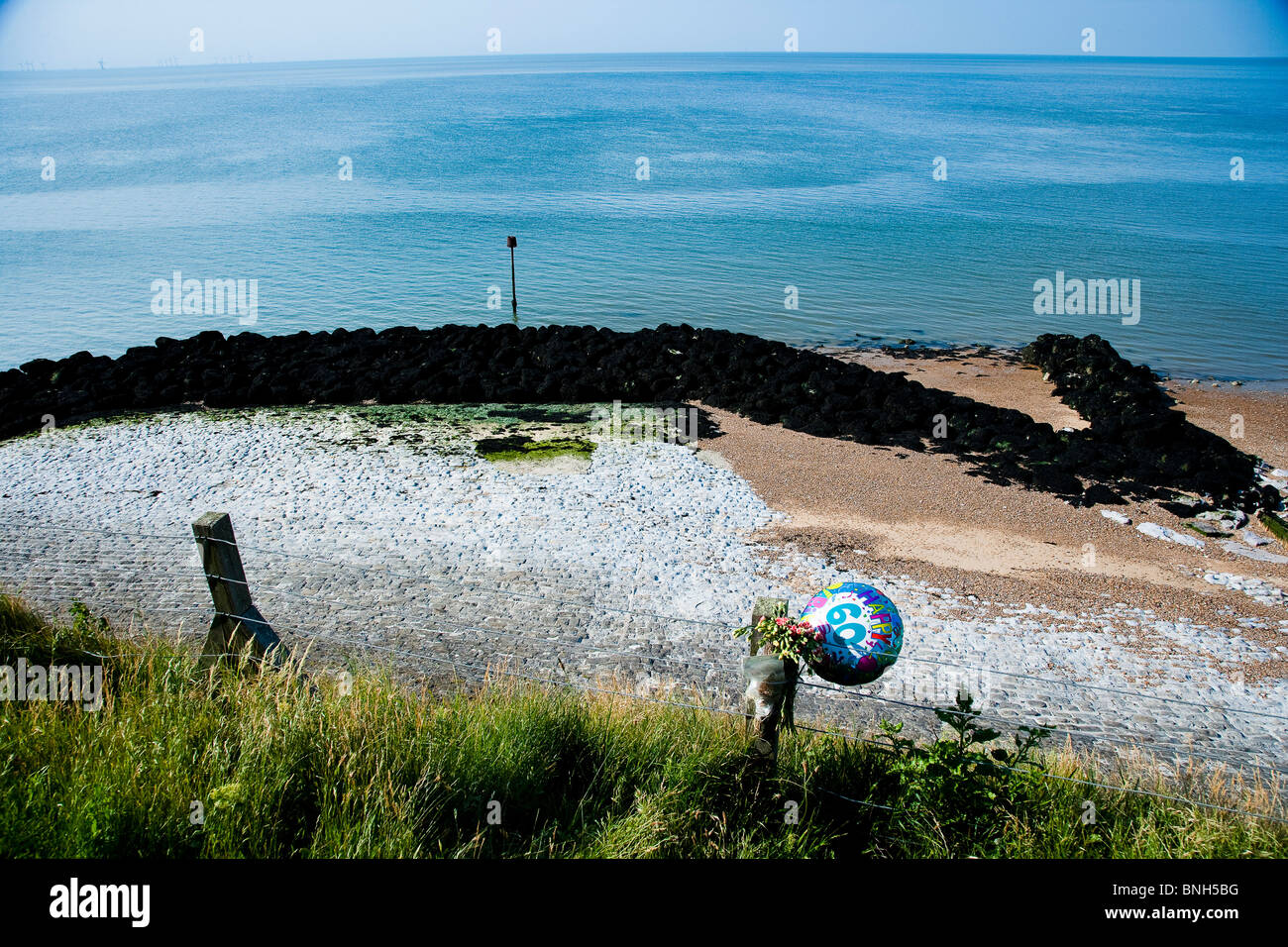 View from Reculver castle on the Kent coastline. Twin towers of Saint ...