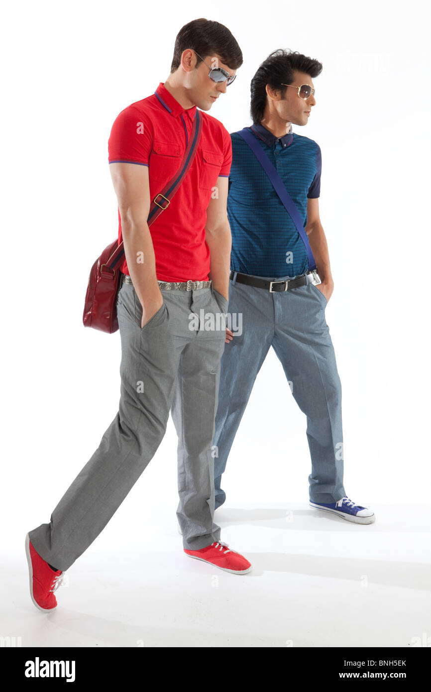 Two young men on white background Stock Photo - Alamy
