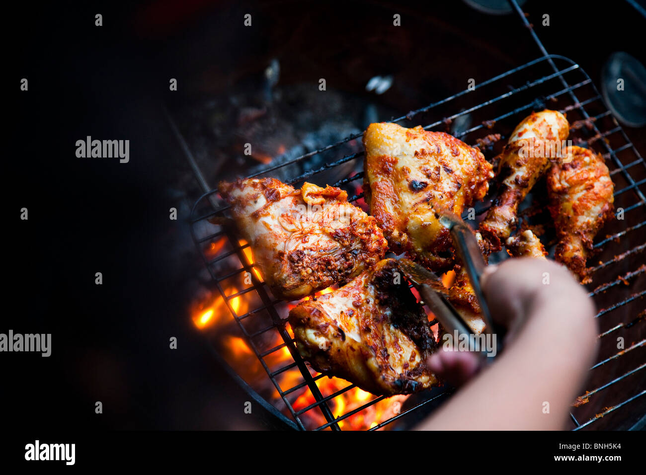 Woman cooking over open fire hi-res stock photography and images - Alamy