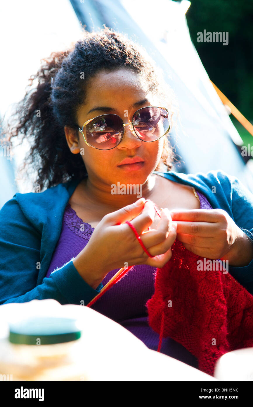 Woman knitting when camping in Kent Stock Photo - Alamy