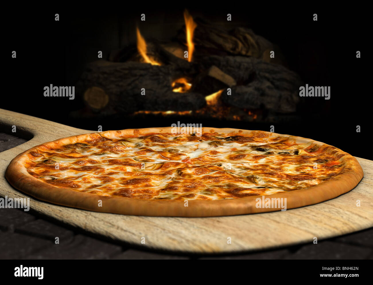 Pizza resting on a pizza peel near an open fire Stock Photo - Alamy