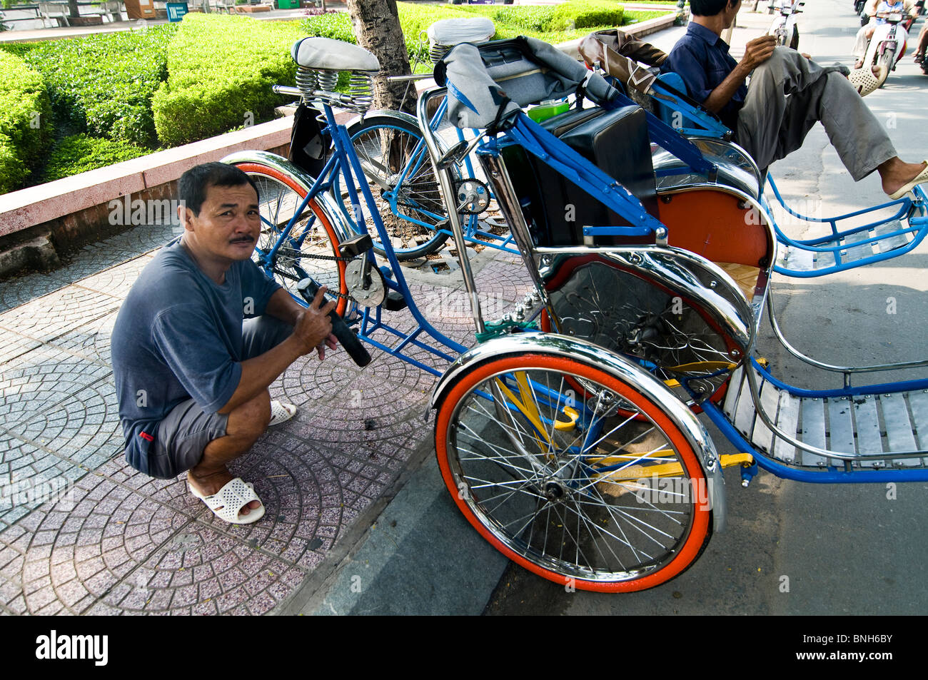 Cyclo drivers in Saigon, Vietnam Stock Photo - Alamy