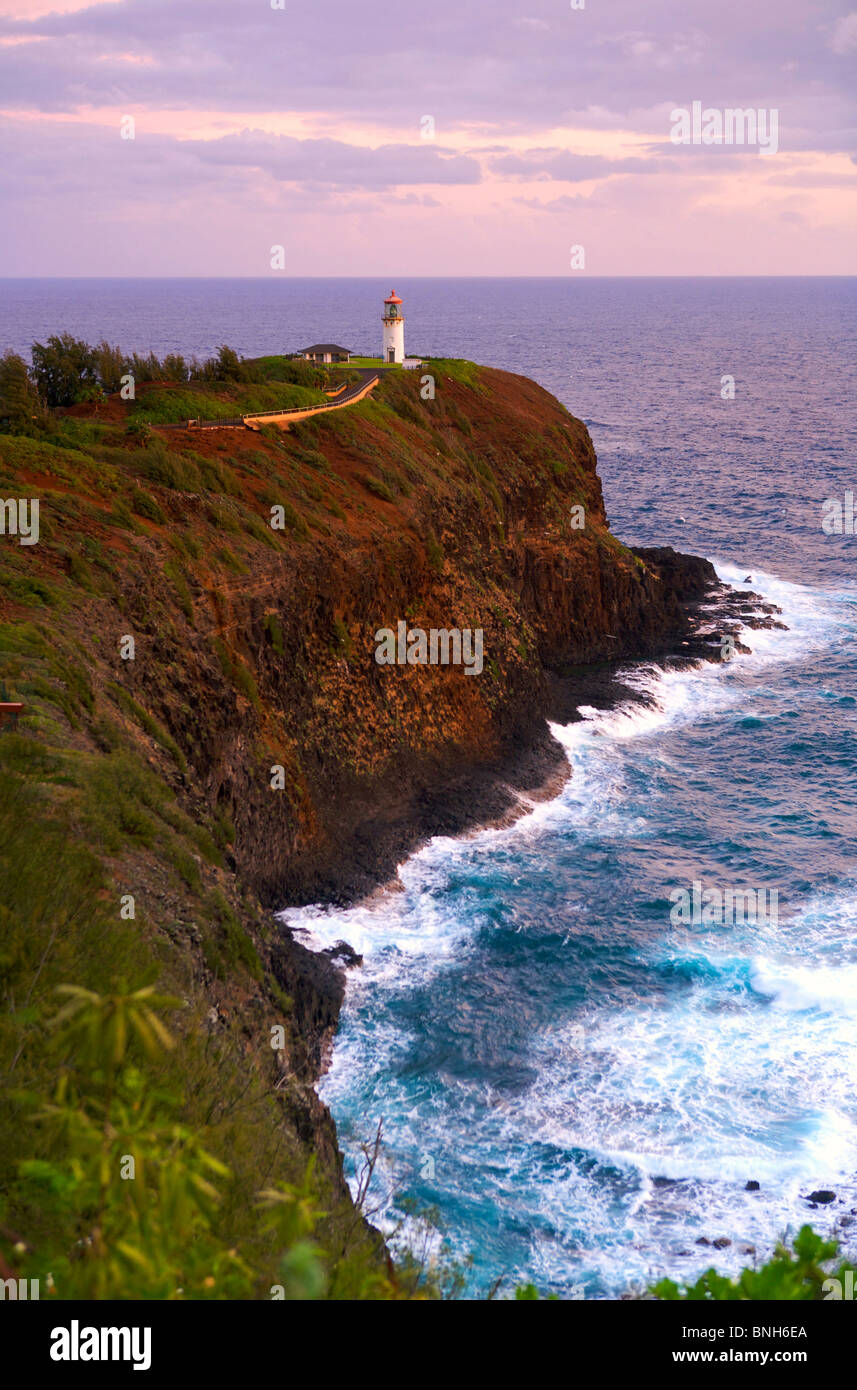 Lighthouse on a cliff at sunset Stock Photo - Alamy