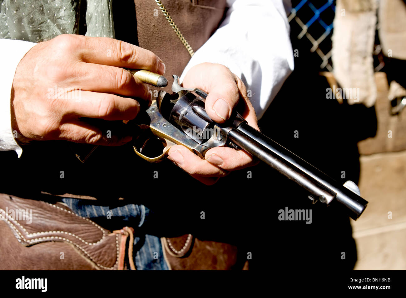Up close horizontal photo loading bullets into a handgun Stock Photo ...