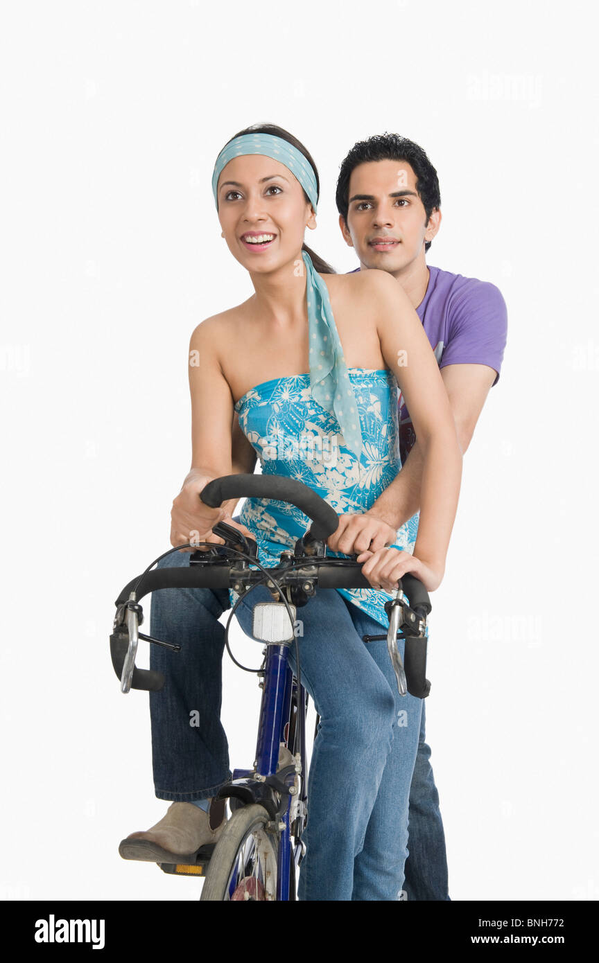 Couple on a bicycle Stock Photo - Alamy