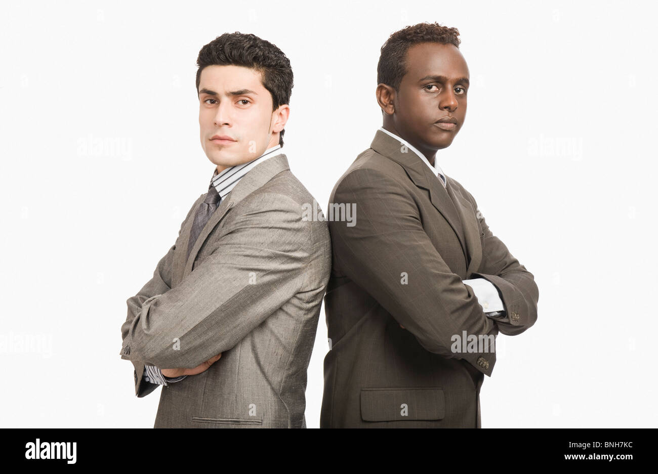Two business men standing back hi-res stock photography and images - Alamy