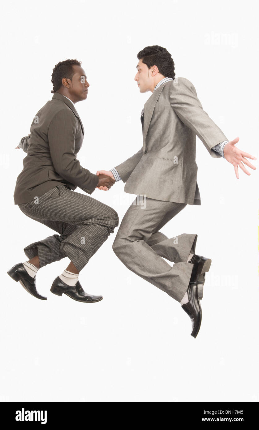 Business men shaking hands in Cut Out Stock Images & Pictures - Alamy