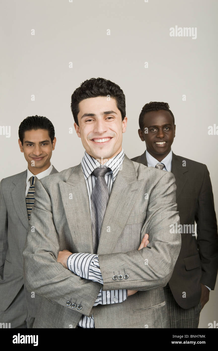Portrait of three businessmen smiling Stock Photo - Alamy