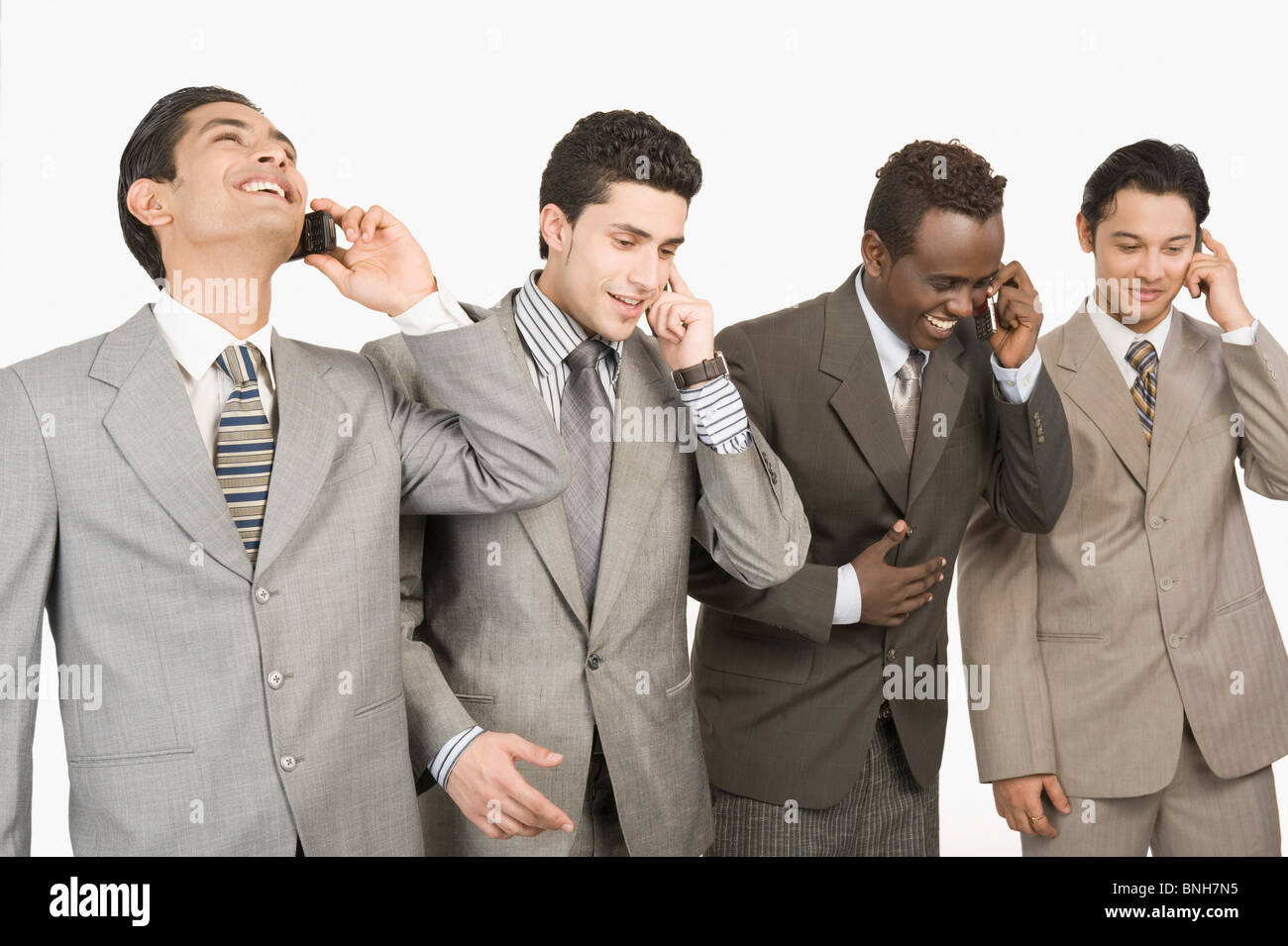 Group people holding phones up adults hi-res stock photography and ...