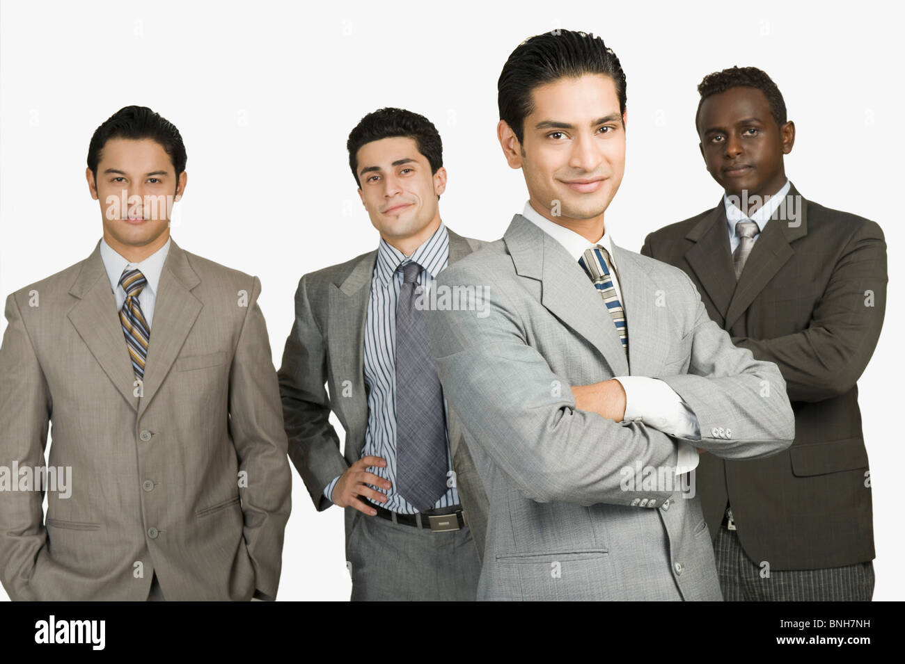 Group four smiling businessmen dressed hi-res stock photography and ...