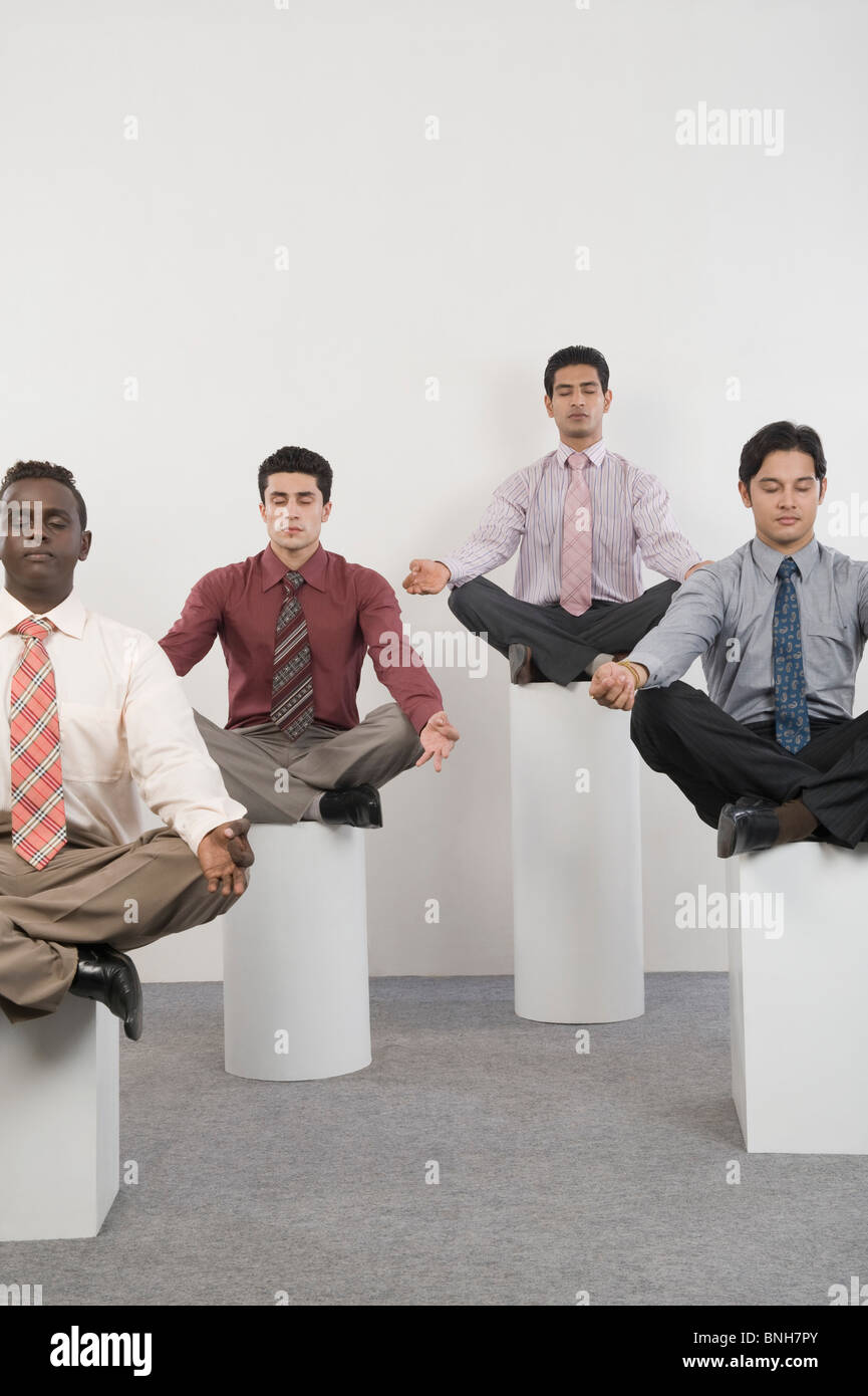 Group four people practicing yoga hi-res stock photography and images ...