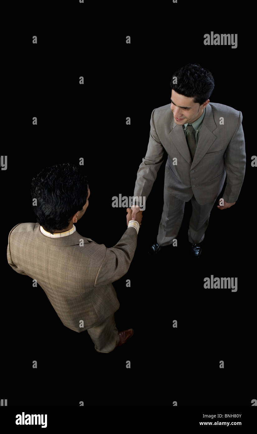 Shaking hands indian asian Cut Out Stock Images & Pictures - Alamy