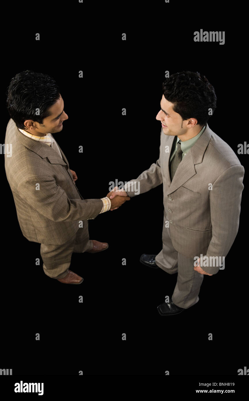 Shaking hands indian asian Cut Out Stock Images & Pictures - Alamy