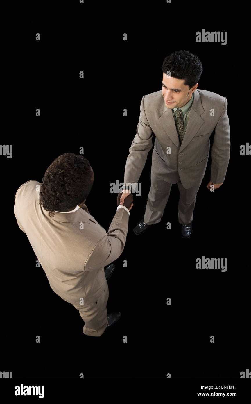 Shaking hands indian asian Cut Out Stock Images & Pictures - Alamy