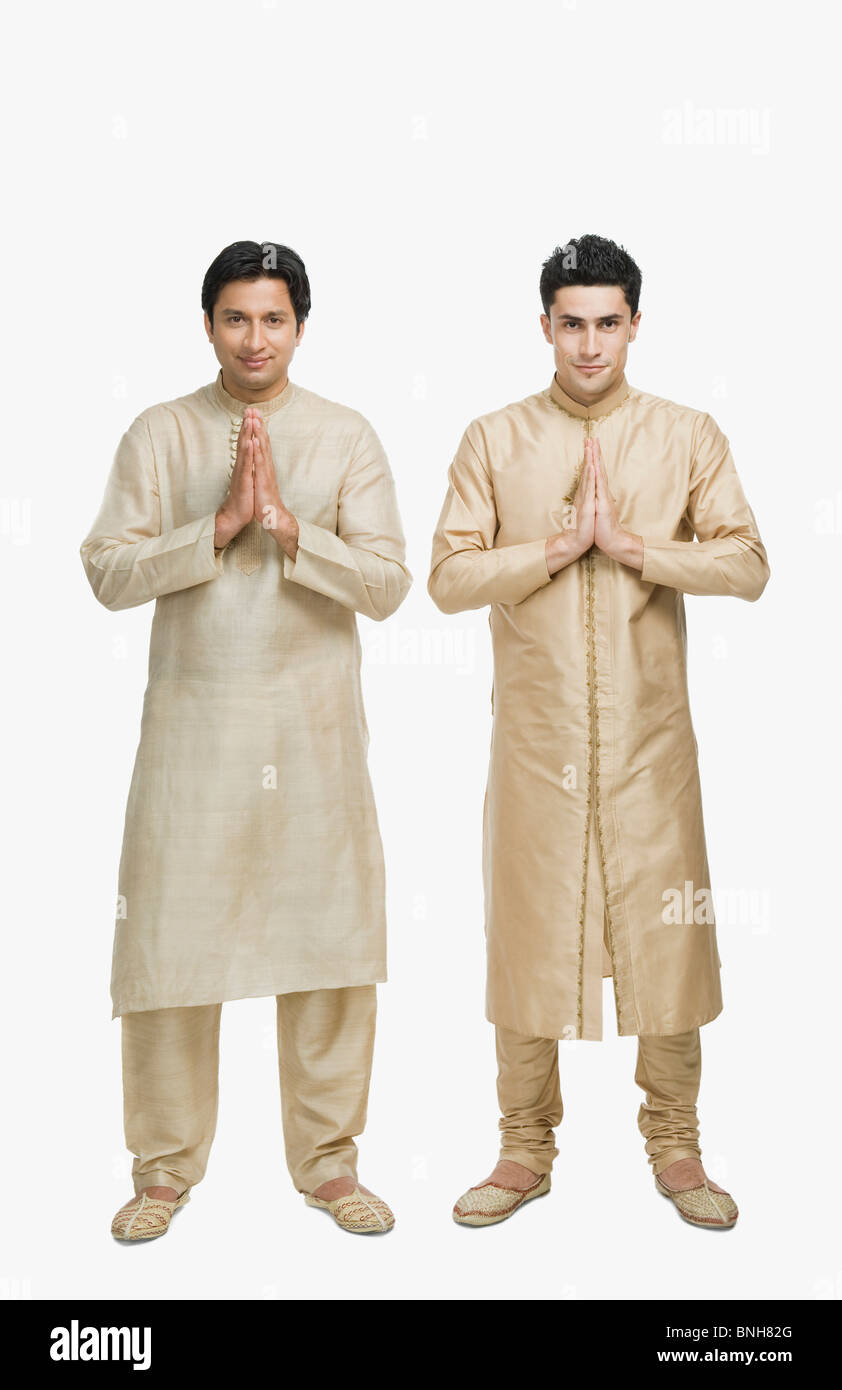 Two men in prayer position Stock Photo - Alamy