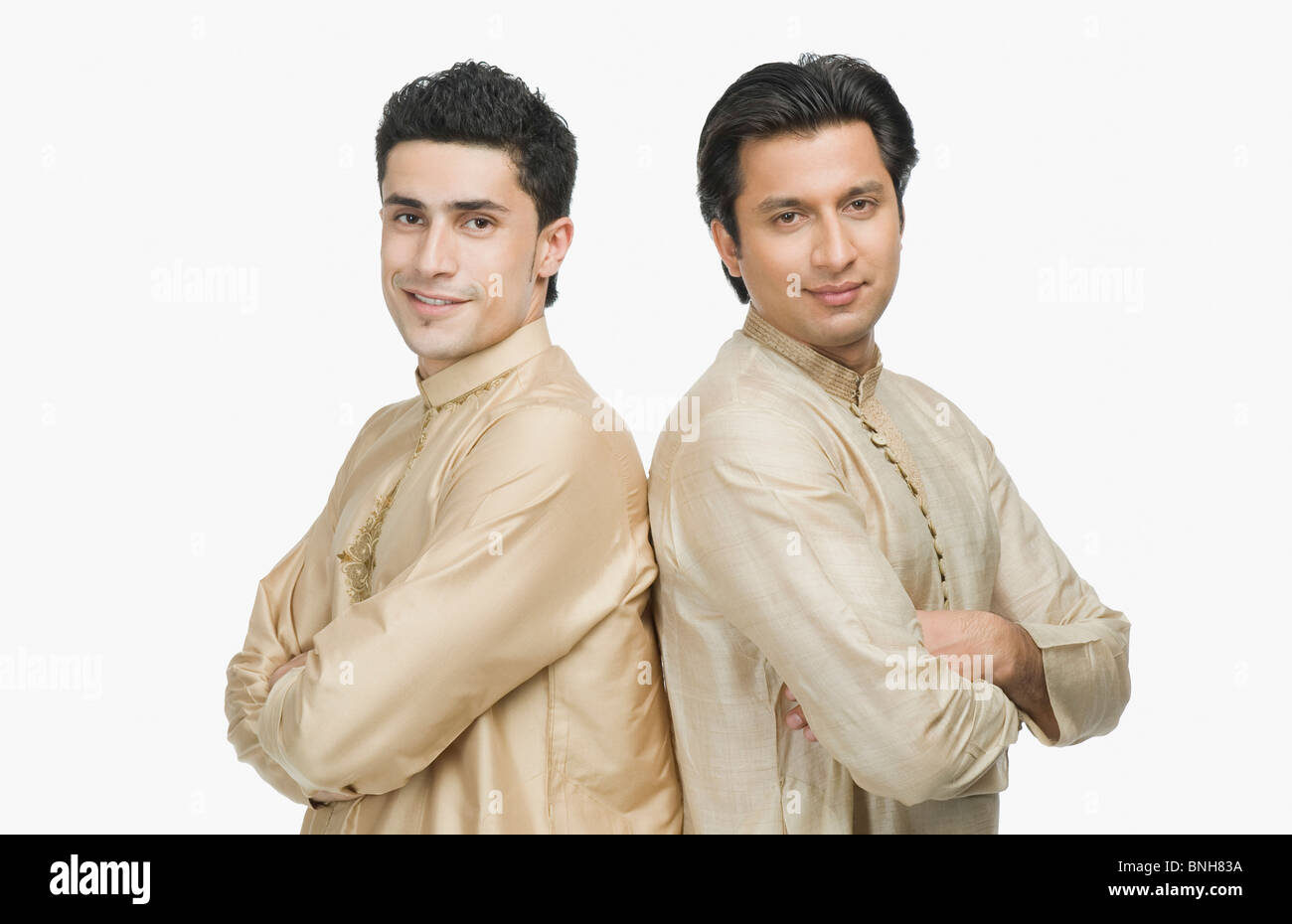 Two men posing with arms crossed Stock Photo - Alamy