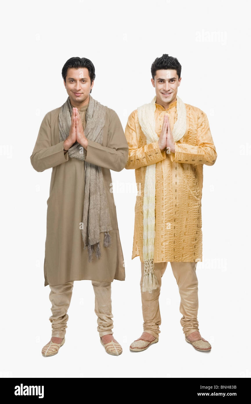 Two men in prayer position Stock Photo - Alamy