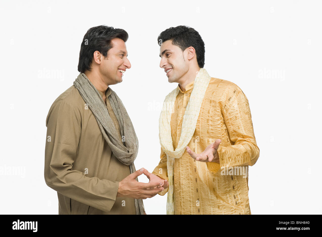 Two men talking with each other Stock Photo - Alamy