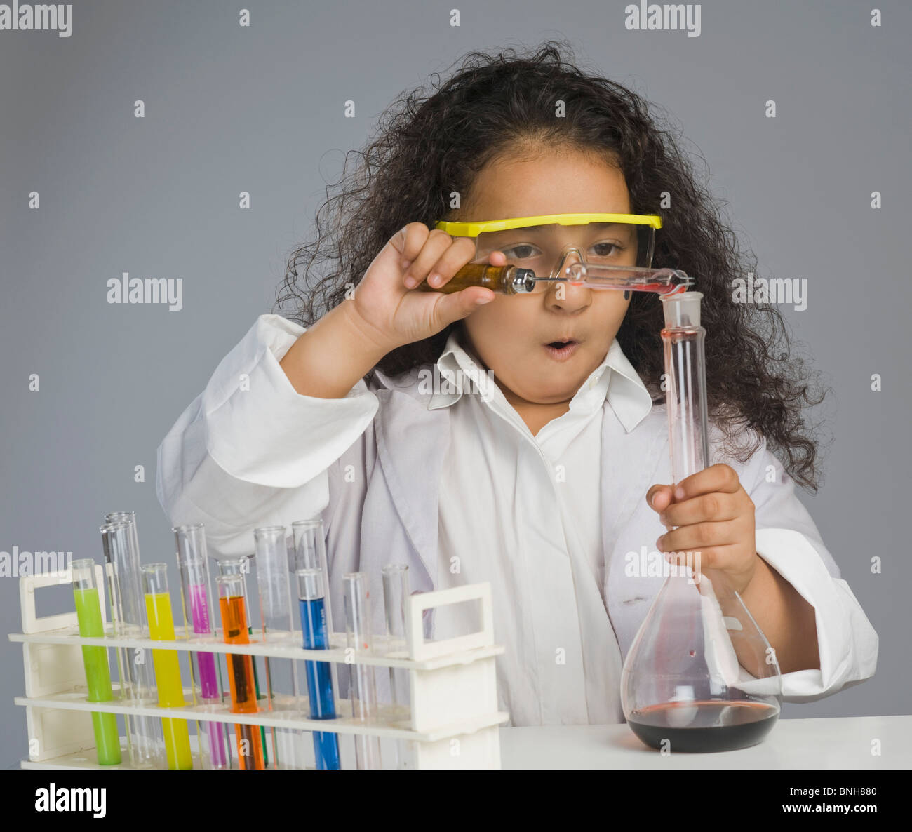 Girl dressed as scientist researching in the laboratory Stock Photo - Alamy