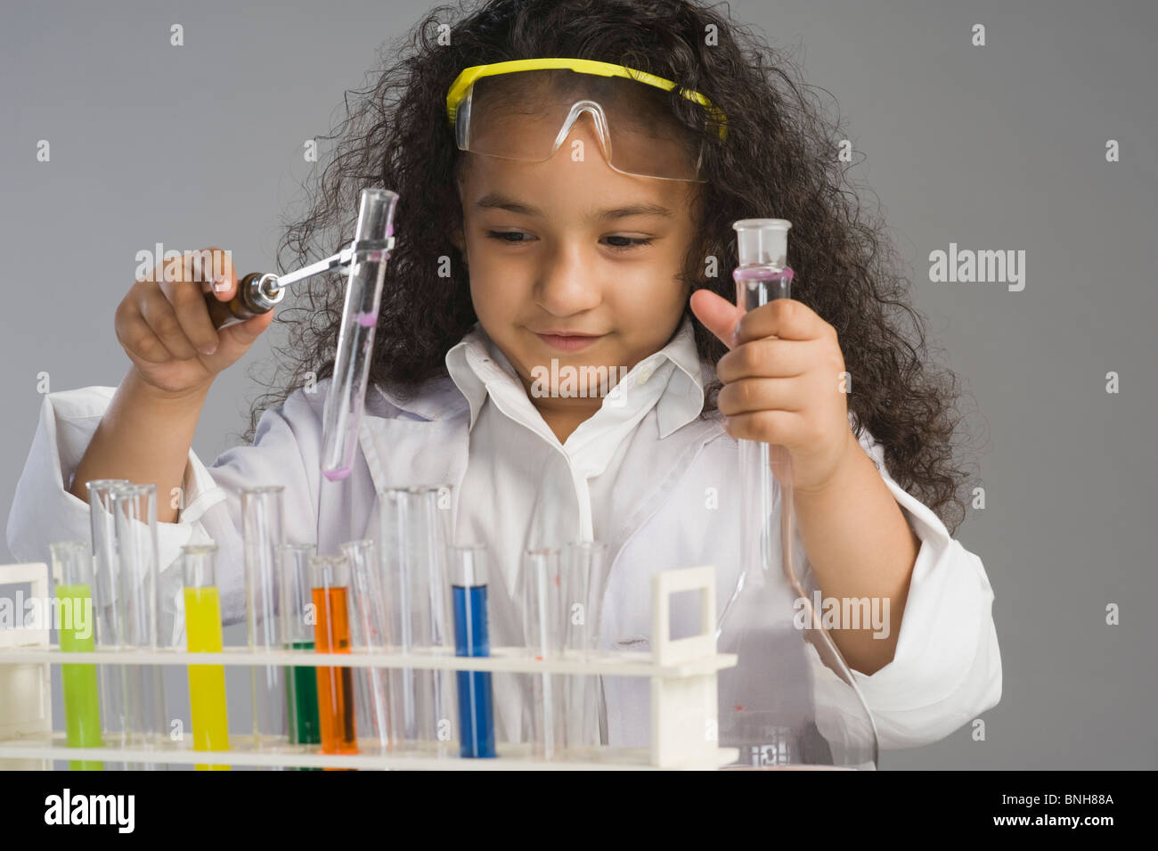 Girl dressed as scientist researching in the laboratory Stock Photo - Alamy