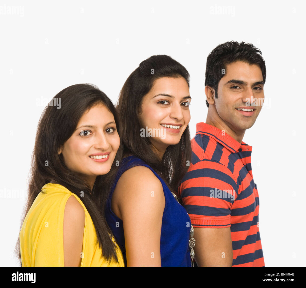 Portrait of three friends standing in a row and smiling Stock Photo - Alamy
