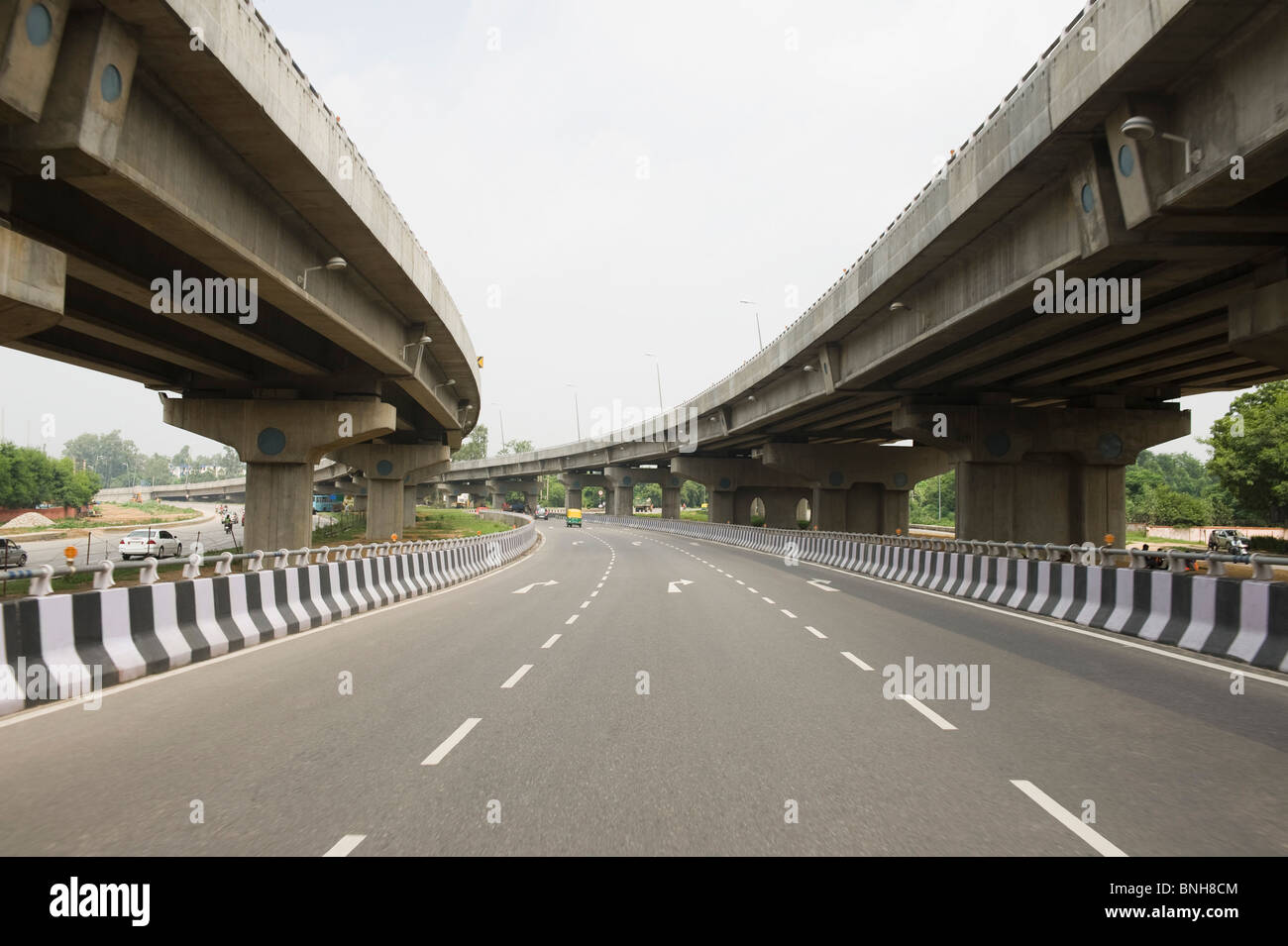 Road in the middle of overpasses, National Highway 8, New Delhi, India ...