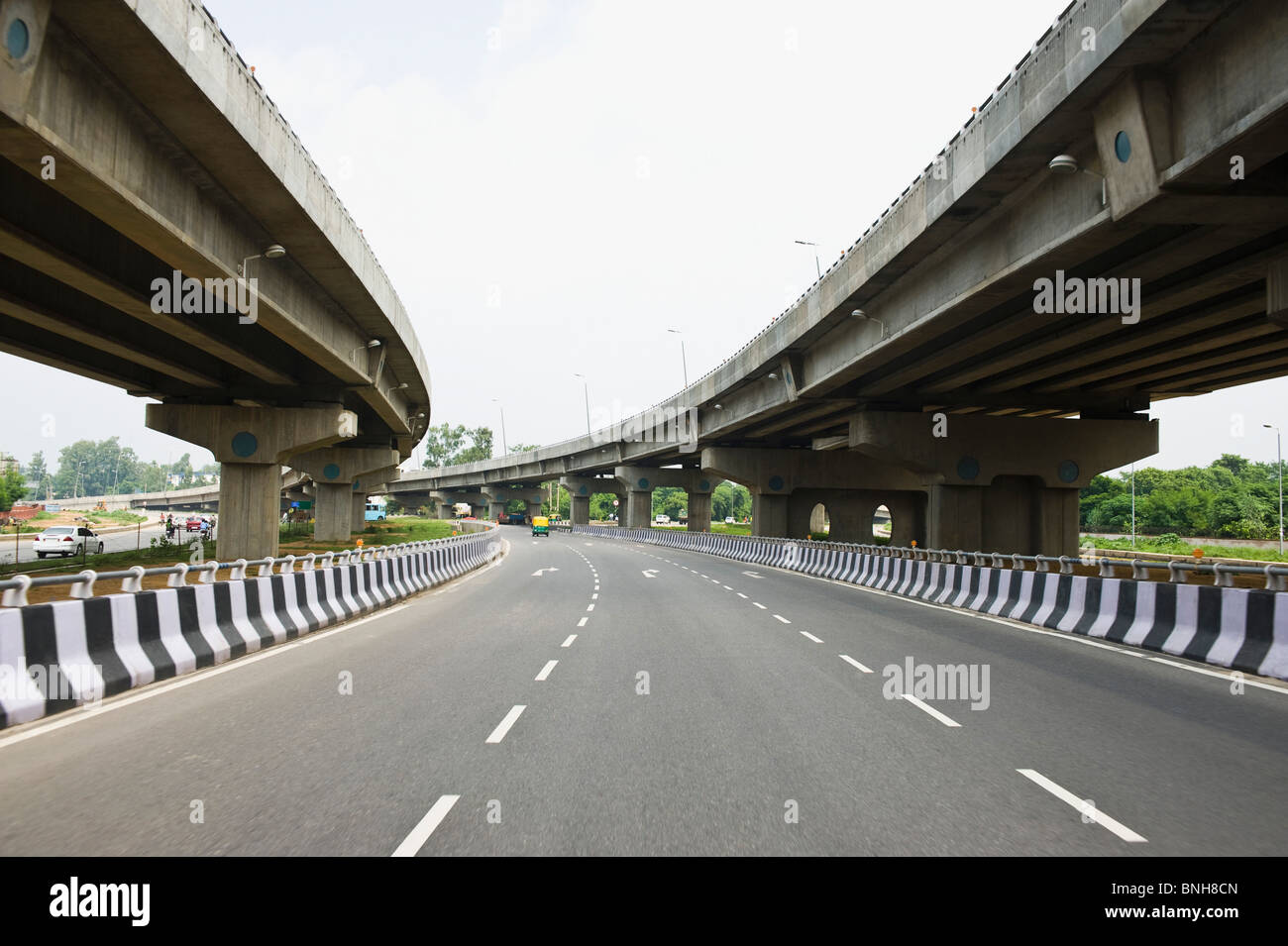 Road in the middle of overpasses, National Highway 8, New Delhi, India ...