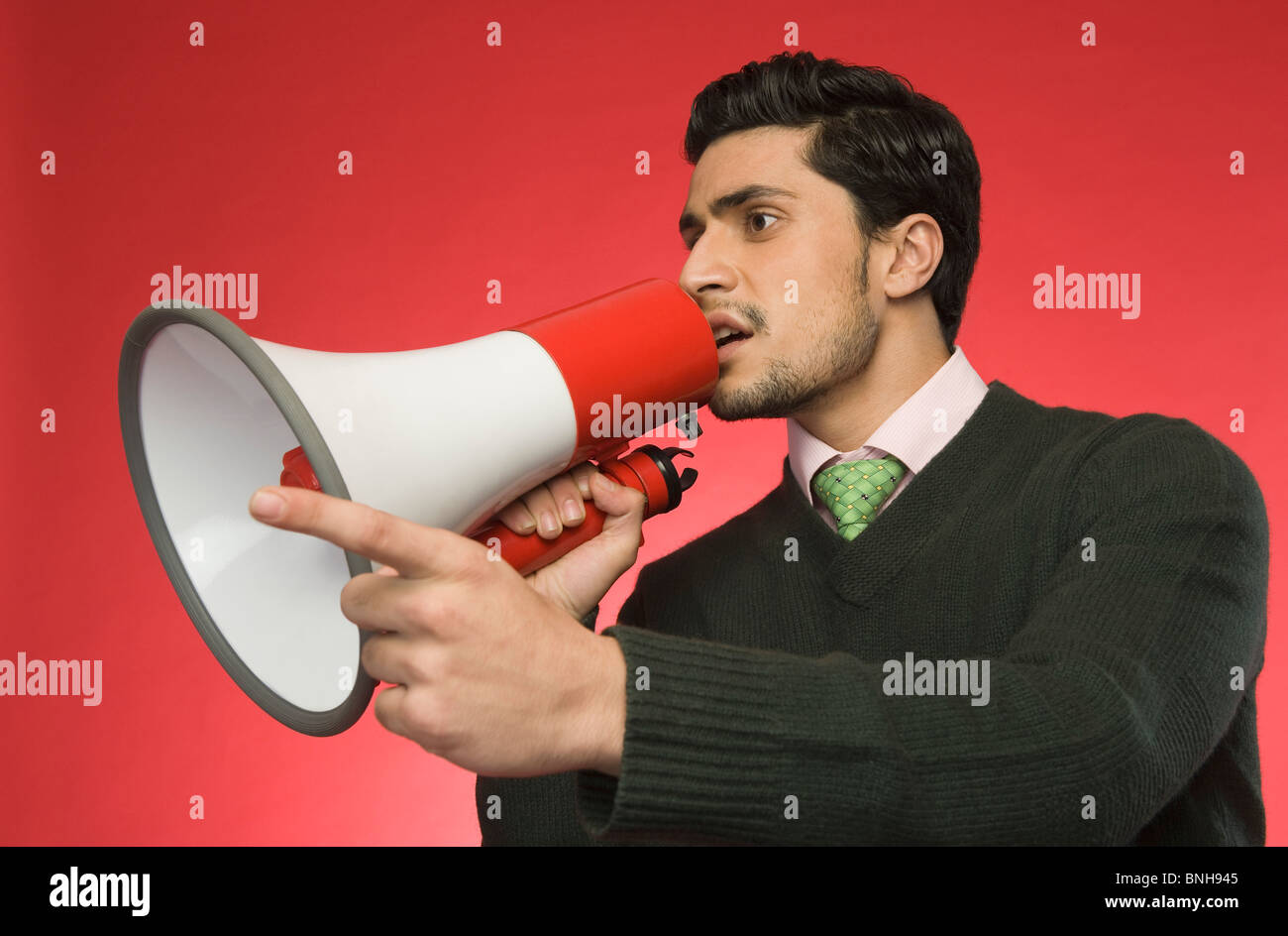 Businessman with a megaphone Stock Photo - Alamy