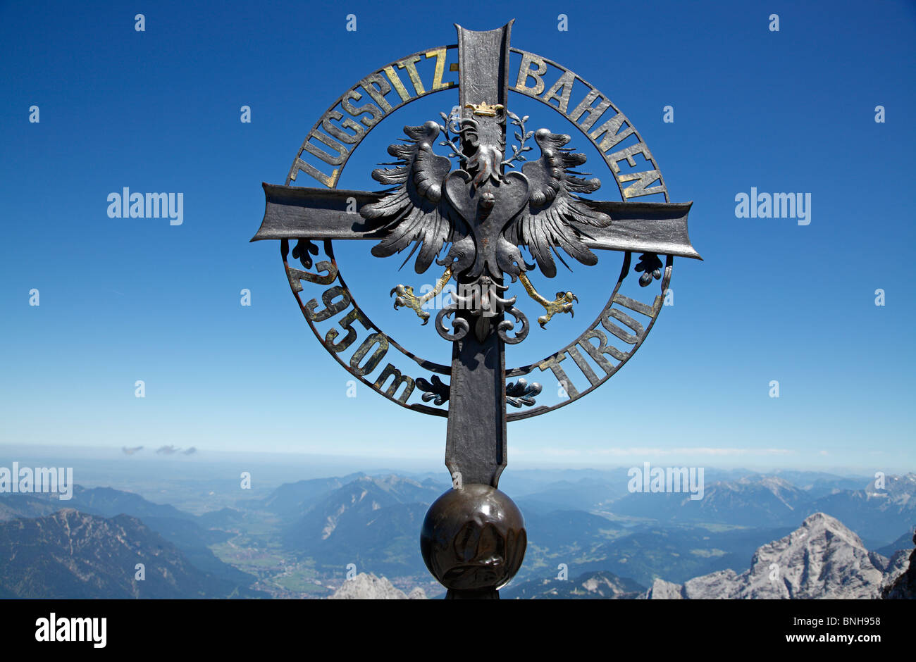 The Zugspitze Railway's crest with the Tyrolean cross on the summit of ...