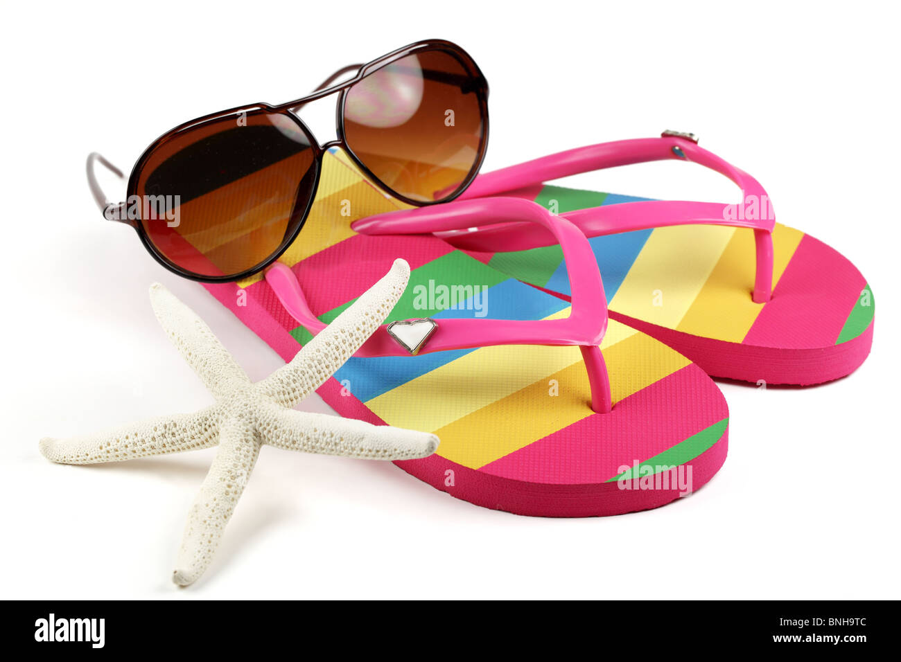 Sunglasses, Flip Flops and Star-fish on white background Stock Photo ...