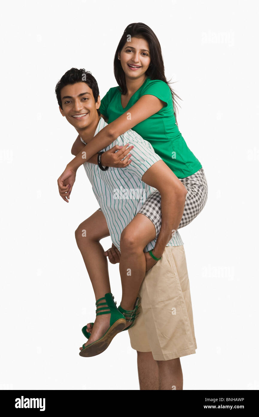 Piggyback adults side view Cut Out Stock Images & Pictures - Alamy
