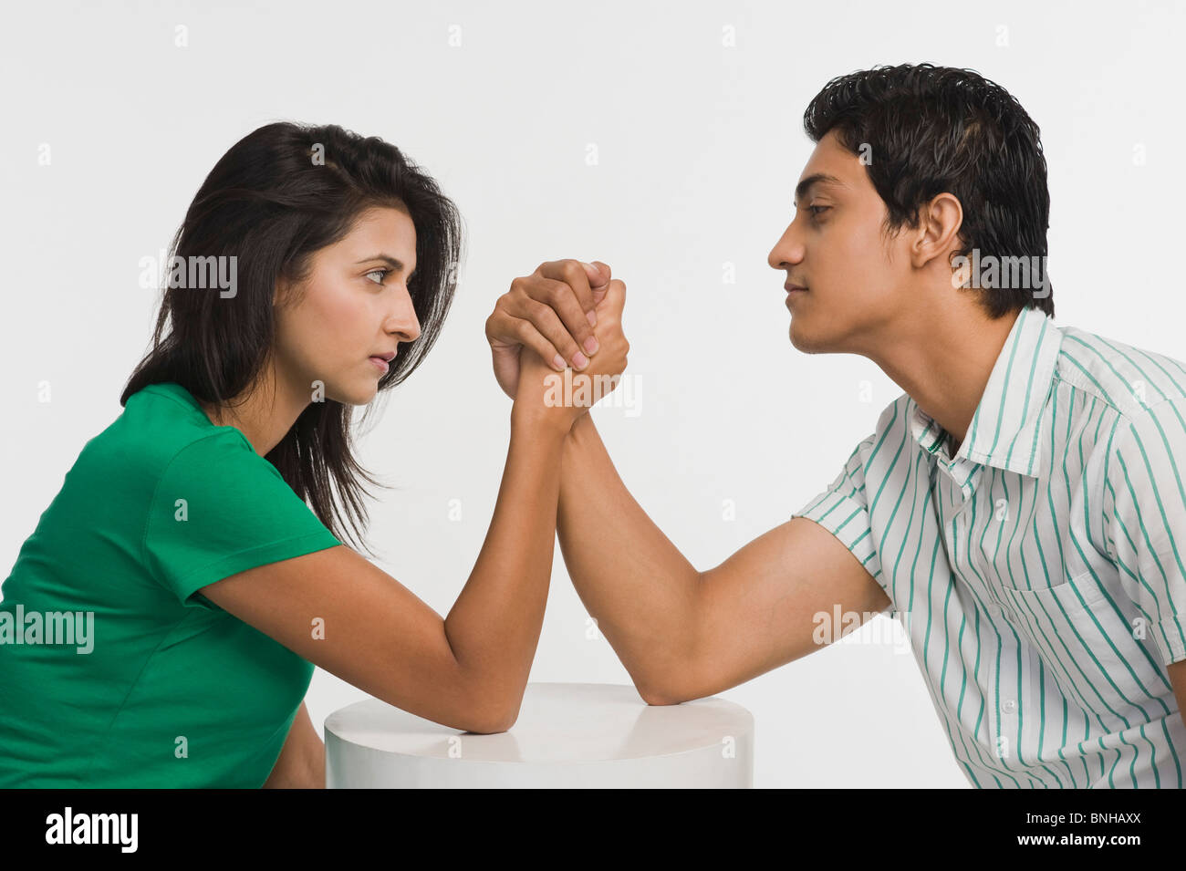 Couple arm wrestling Stock Photo - Alamy