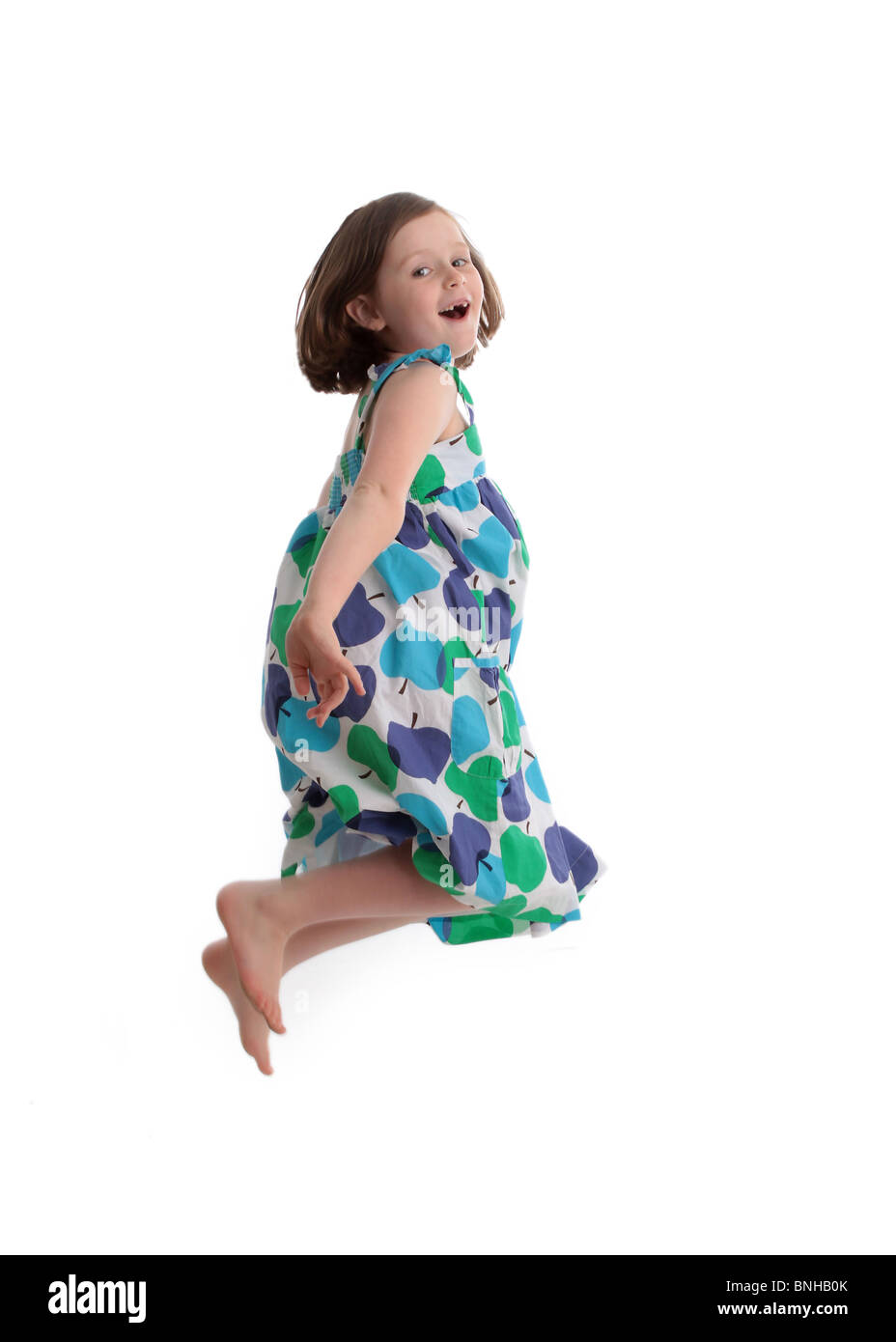 Young female child jumping in white background studio environment ...